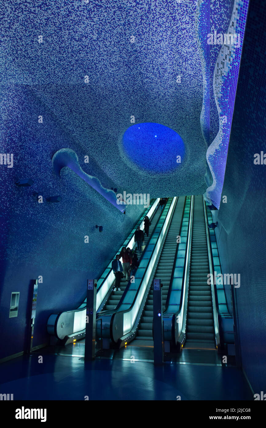 Passengers use escalators at the entrance to the Toledo Metro Station ...