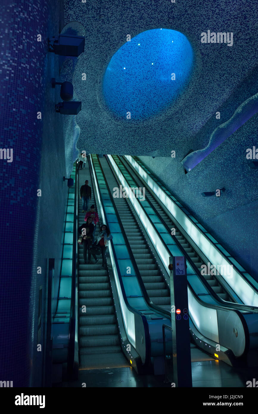 Passengers use escalators at the entrance to the Toledo Metro Station ...