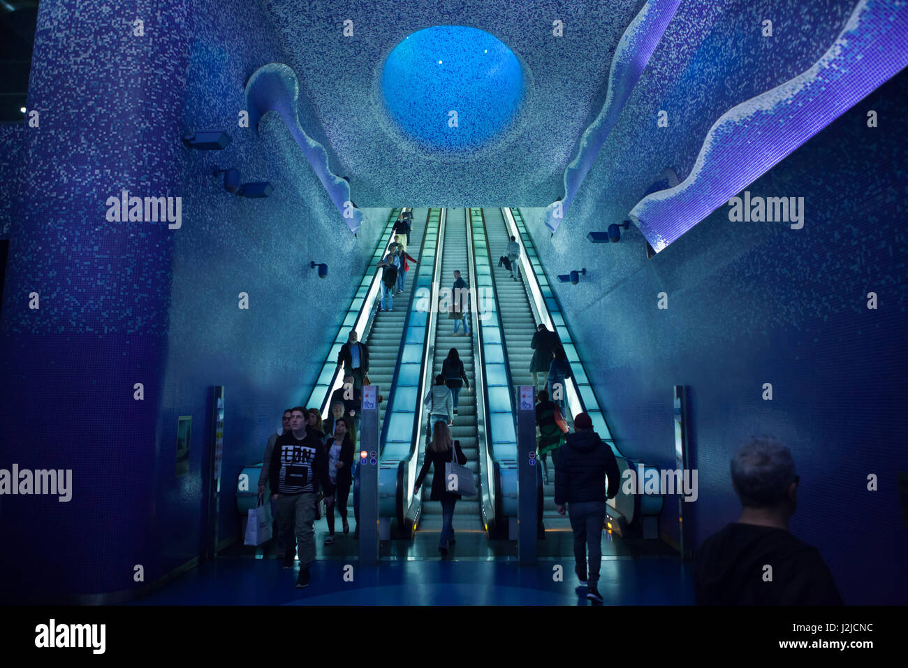 Passengers use escalators at the entrance to the Toledo Metro Station ...