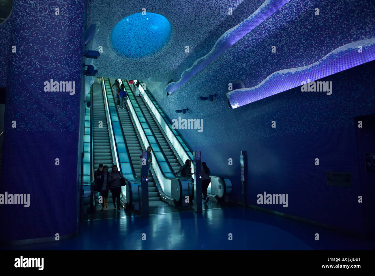 Passengers use escalators at the entrance to the Toledo Metro Station ...