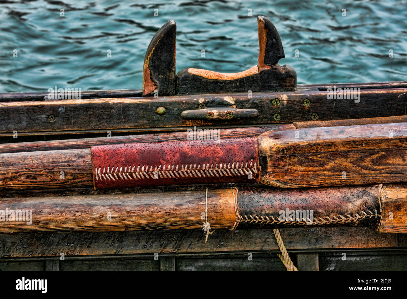 USA, Washington State, Port Townsend. Stowed oars and oar port on ...
