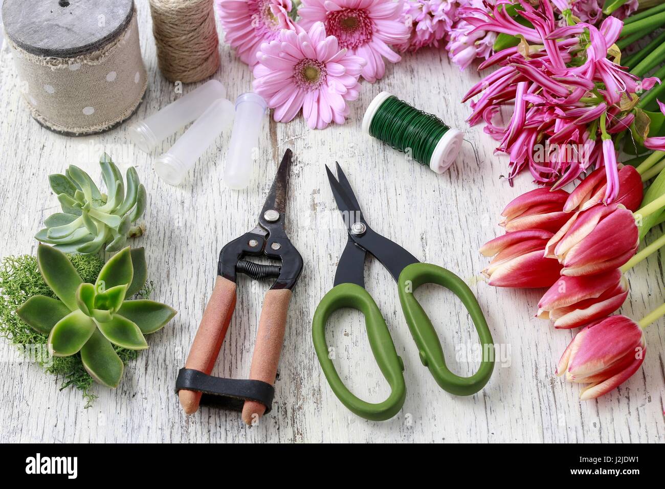 Florist workplace: flowers and accessories. Hobby time Stock Photo - Alamy
