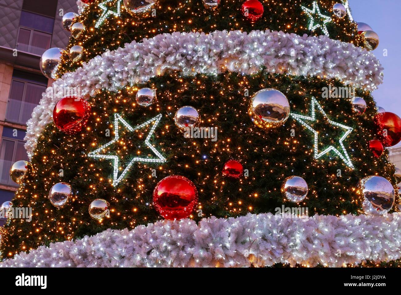 Traditional big christmas tree - festive decor Stock Photo - Alamy