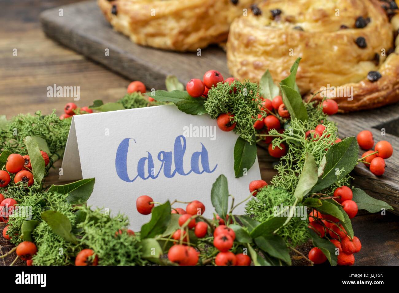 Table place name card with handwritten name Carla. Party decor Stock ...