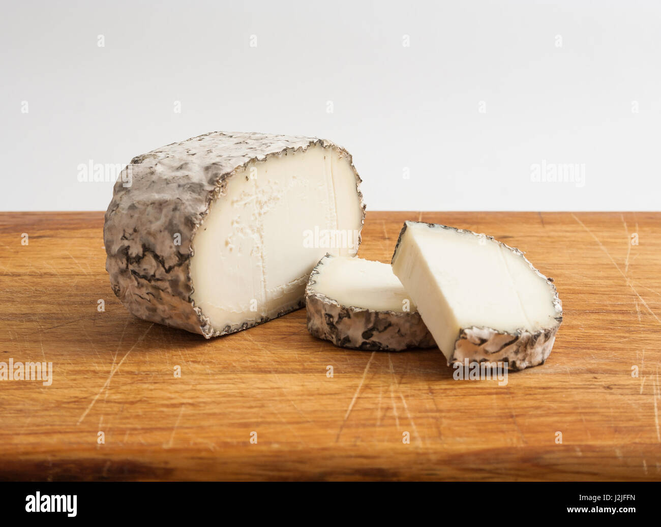 Artisanal goat’s cheese with mould Stock Photo - Alamy