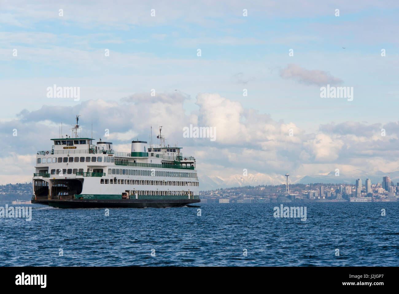 USA, Washington State, Seattle. Ferry heading toward waterfront skyline ...
