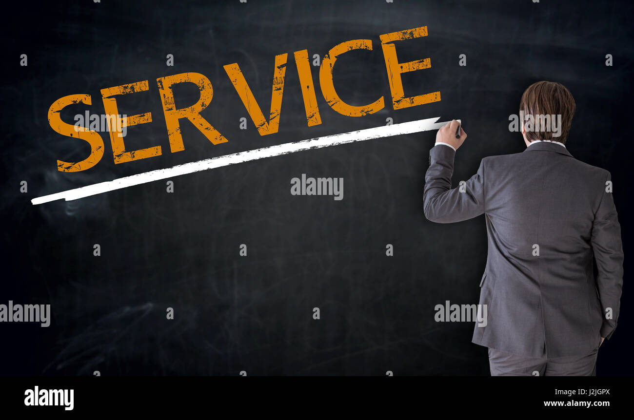 Teacher writes on blackboard hi-res stock photography and images - Alamy