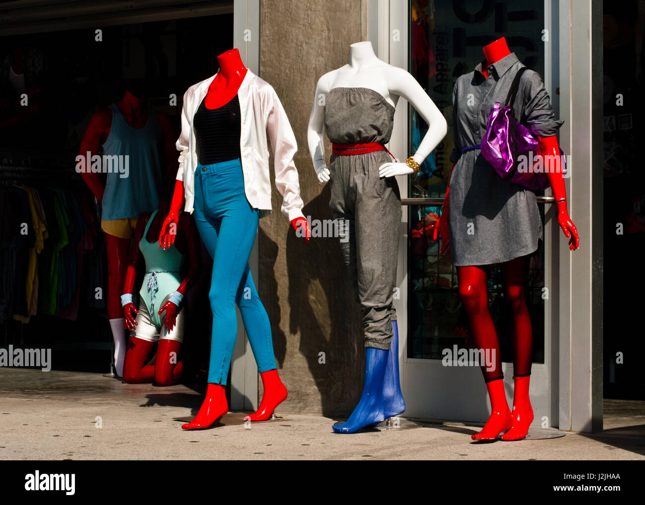 Red mannequins in a storefront display along boardwalk of Venice Beach ...