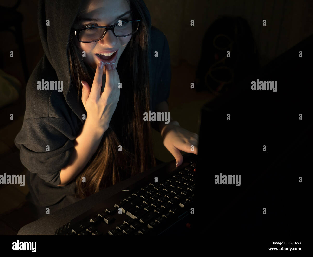 Computer hacker girl stealing information with laptop Stock Photo - Alamy