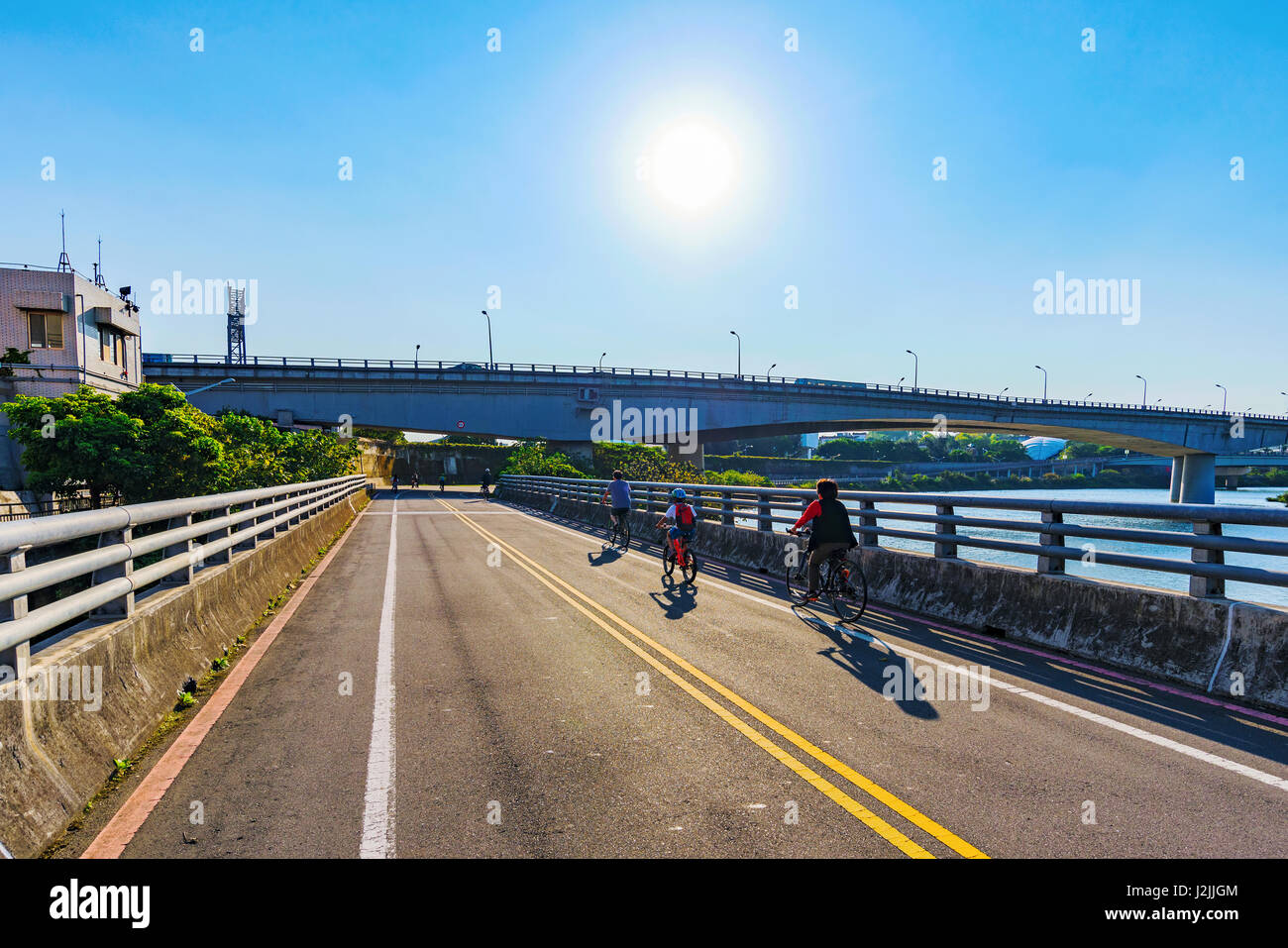Riverside cycling on a sunny day in Taipei Stock Photo - Alamy