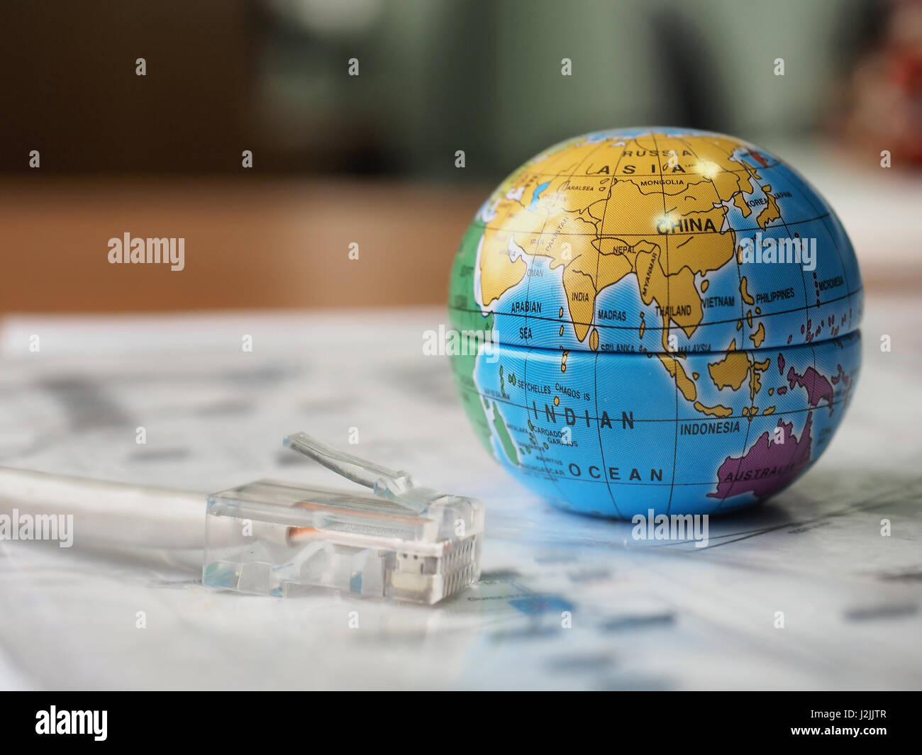 Globe with internet cable. Network in Asia Stock Photo - Alamy