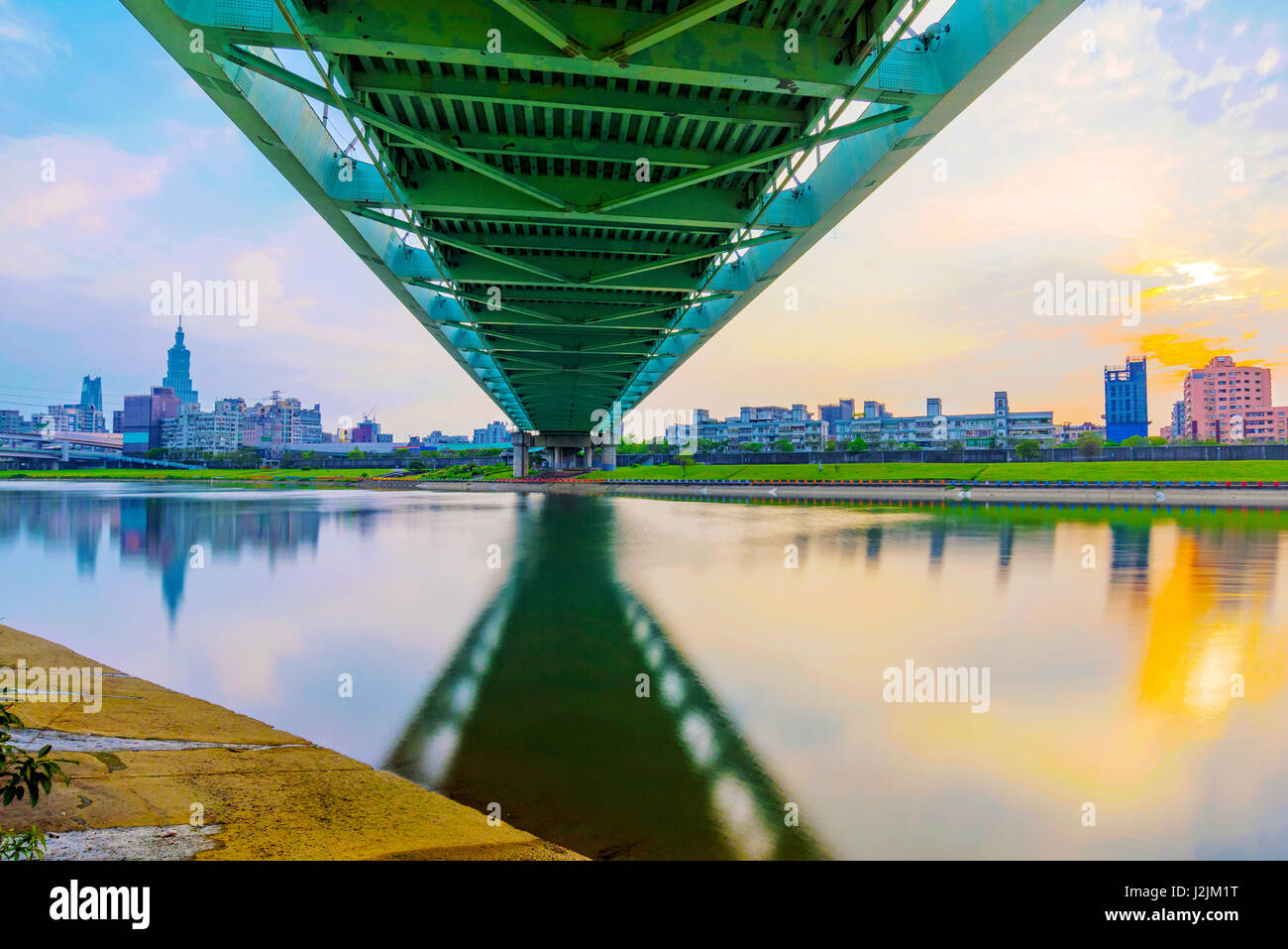 Crescent bridge during sunset with Keelung river in Taipei Stock Photo ...