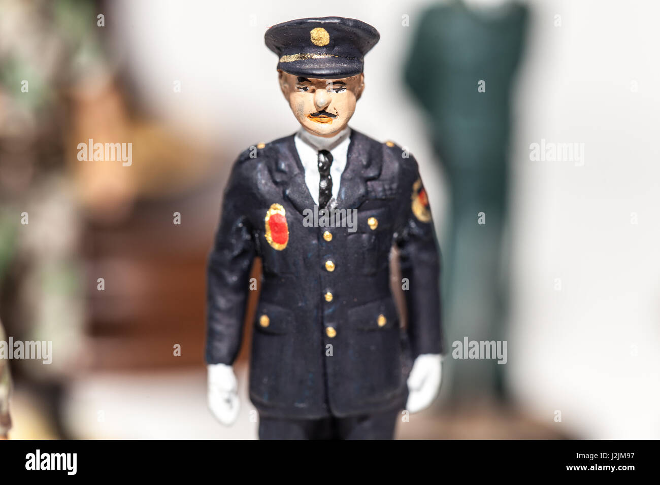 Tiny miniature vintage policeman figurine standing Stock Photo - Alamy