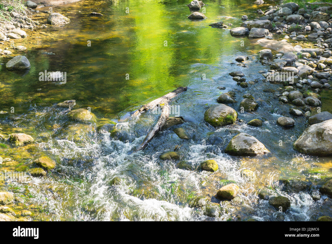 Landscape of still water of the river with colorful reflections of the ...