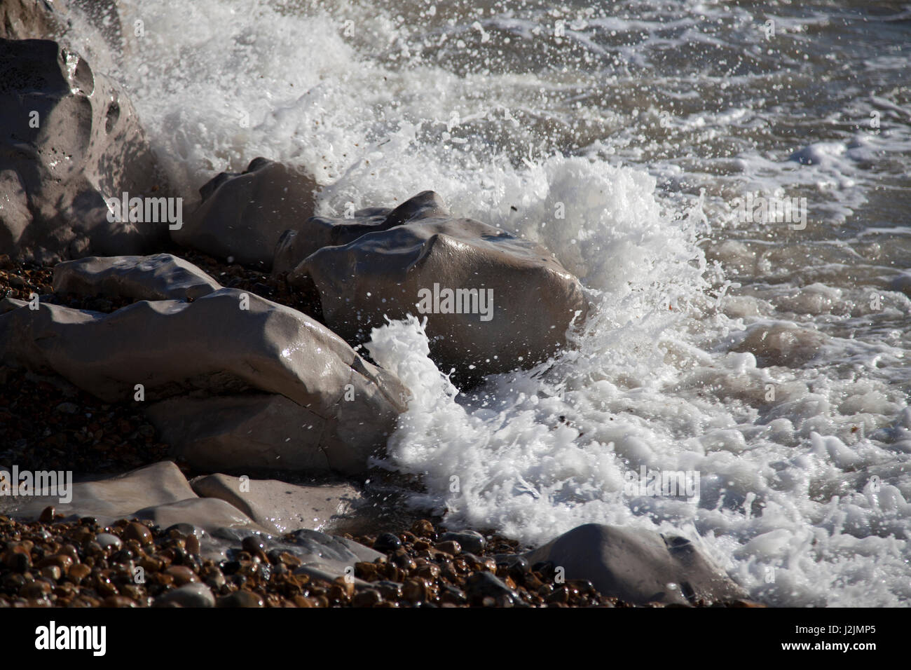 Waves crash against rock shoreline hi-res stock photography and images ...