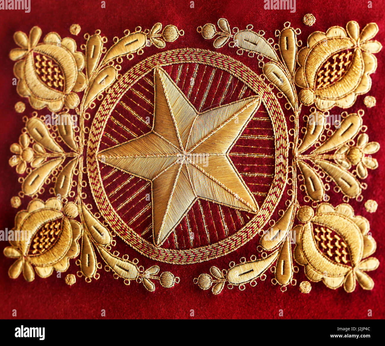 Gold embroidery on a fabric beautiful star on the background patterns ...