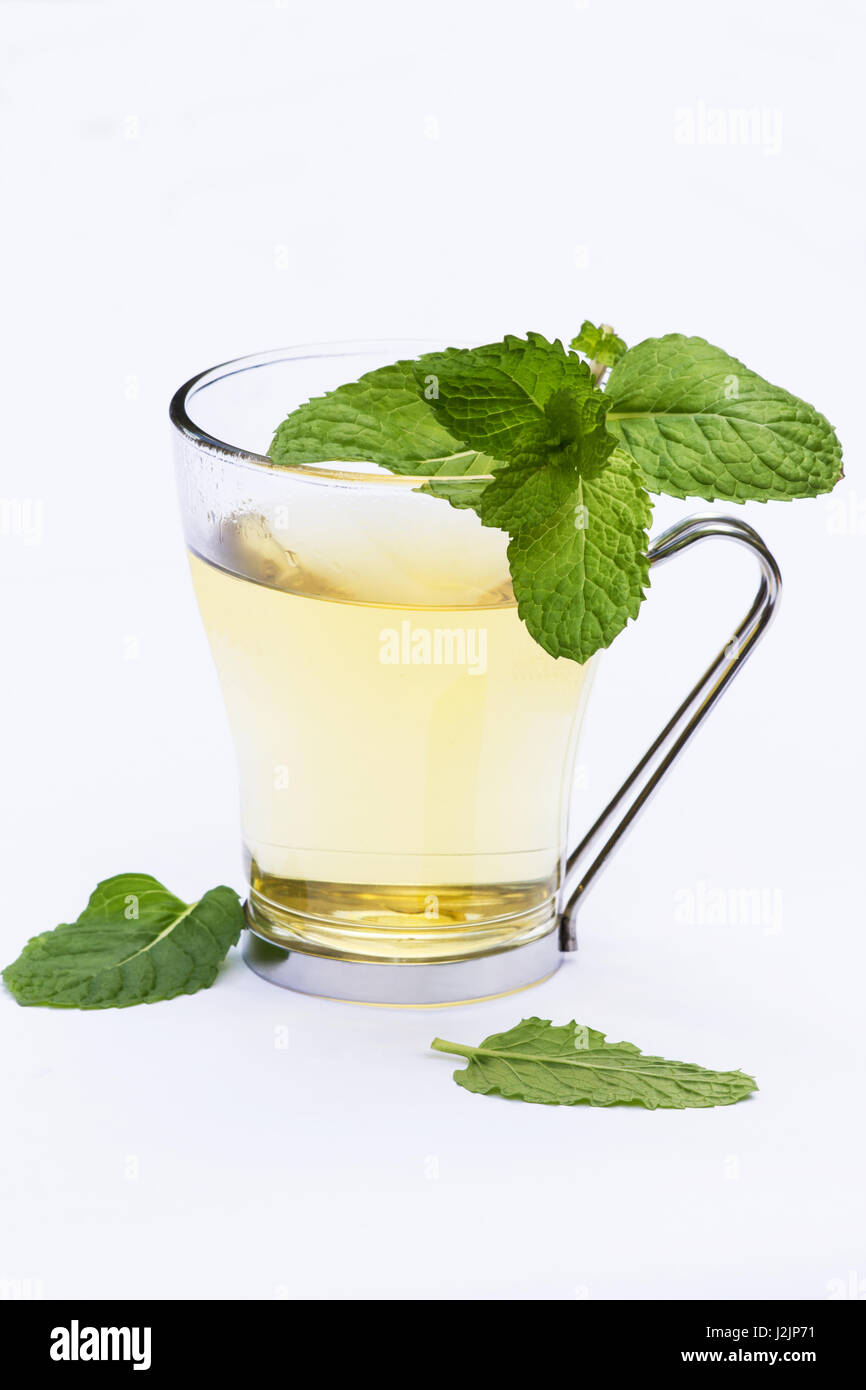 Mint tea and mint leaves on white background Stock Photo - Alamy