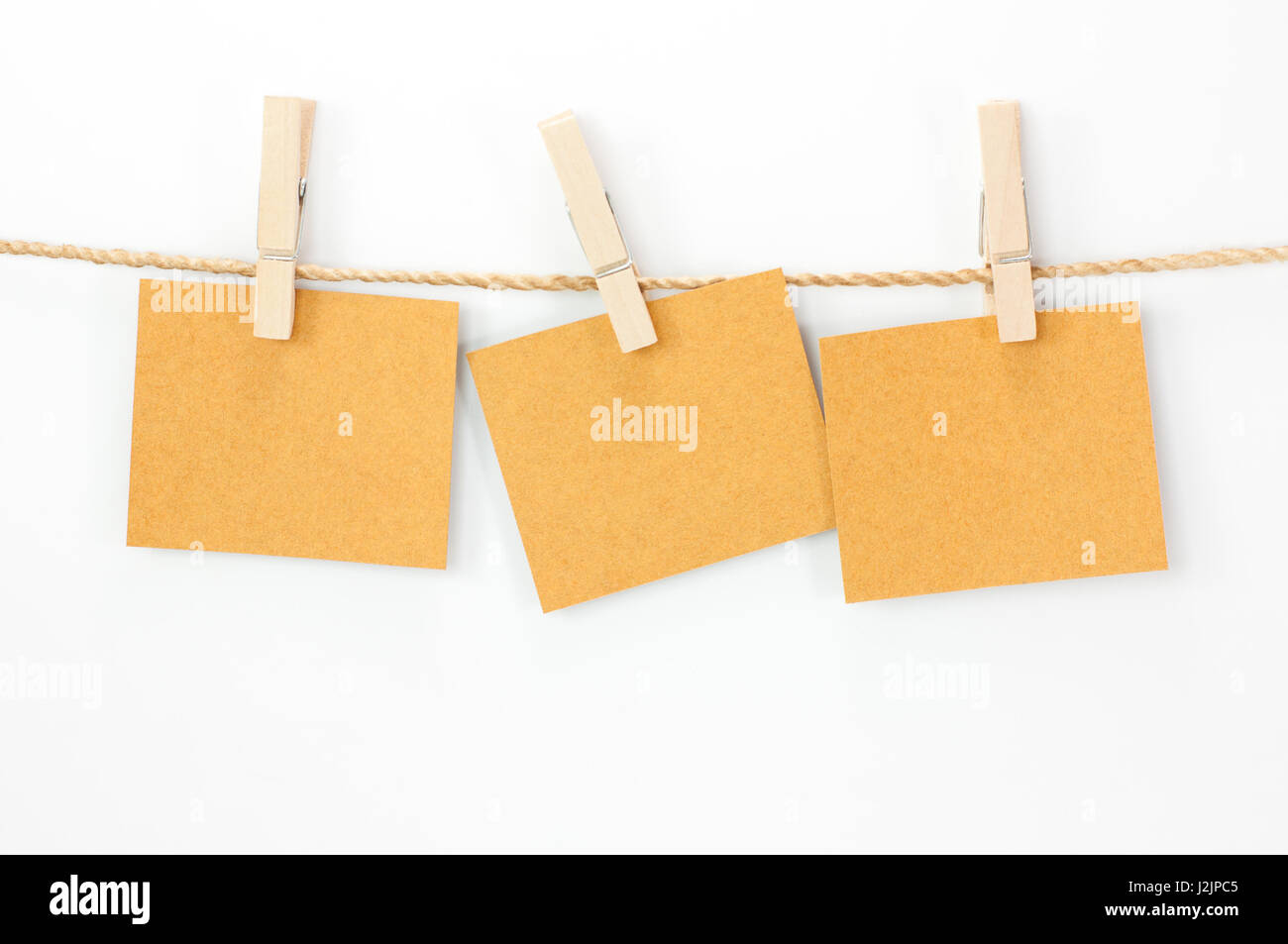 Notice card, brown paper and wood clips on white background Stock Photo ...