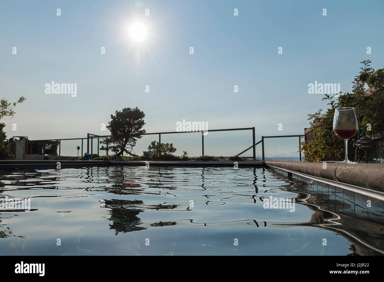 Wine swimming pool sun in the sky Stock Photo - Alamy