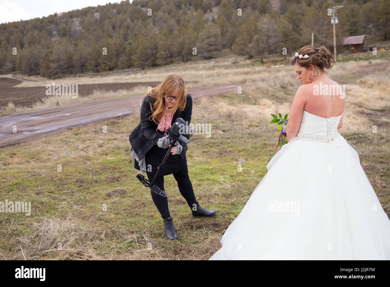 Wedding Videographer with Bride Stock Photo - Alamy