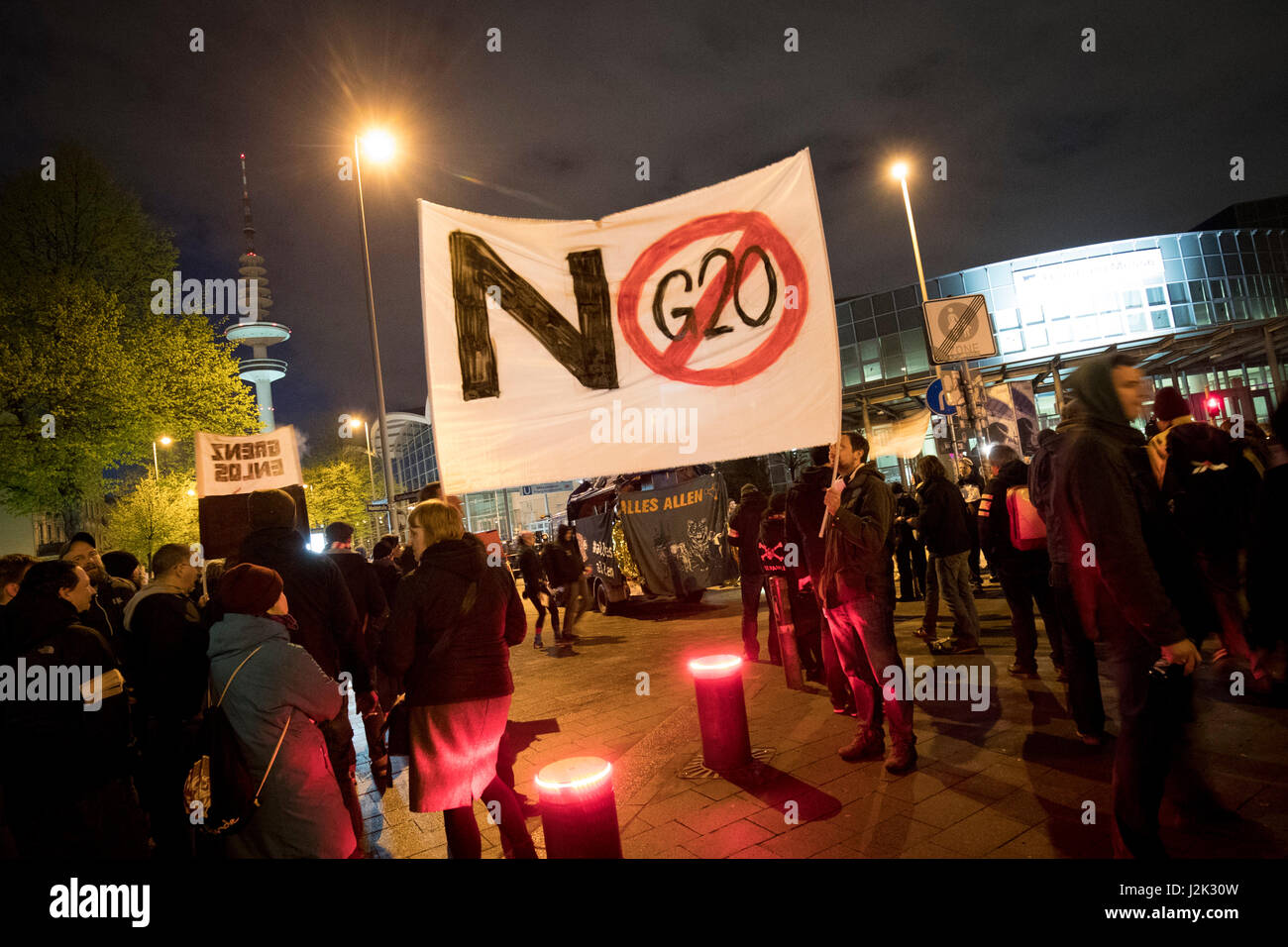 Protestors can be seen in front of the exhibition halls in Hamburg ...