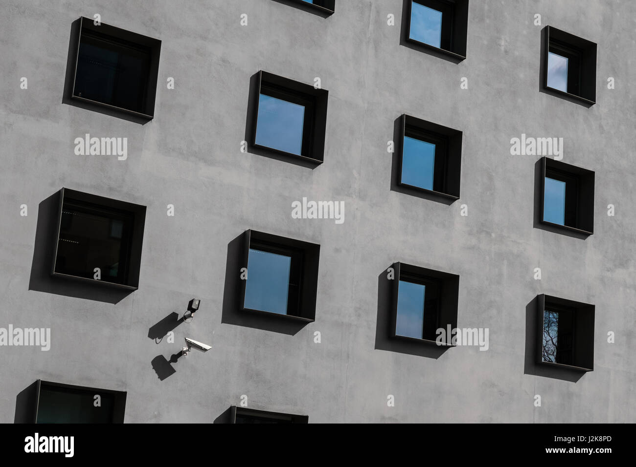 windows on building exterior and security cameras Stock Photo - Alamy