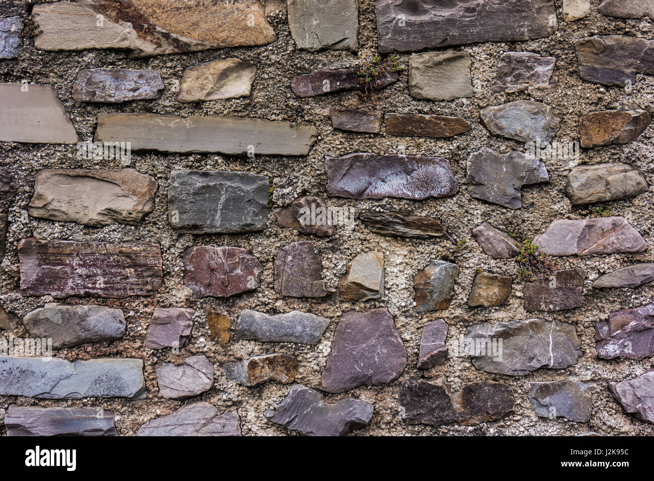 old stone wall. pattern of decorative slate stone wall surface ...