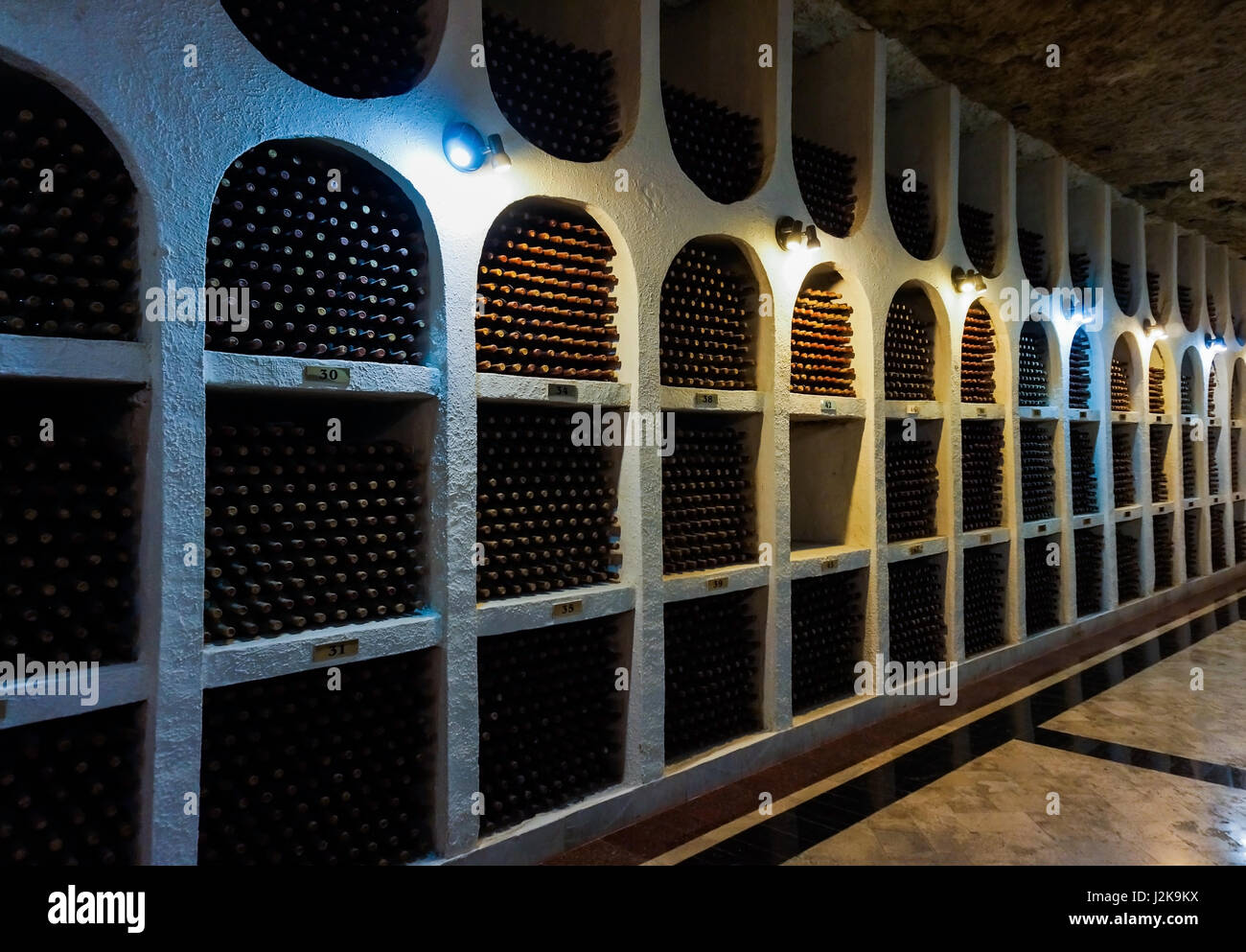 Bottles of high quality wine in the traditional wine cellar Stock Photo ...