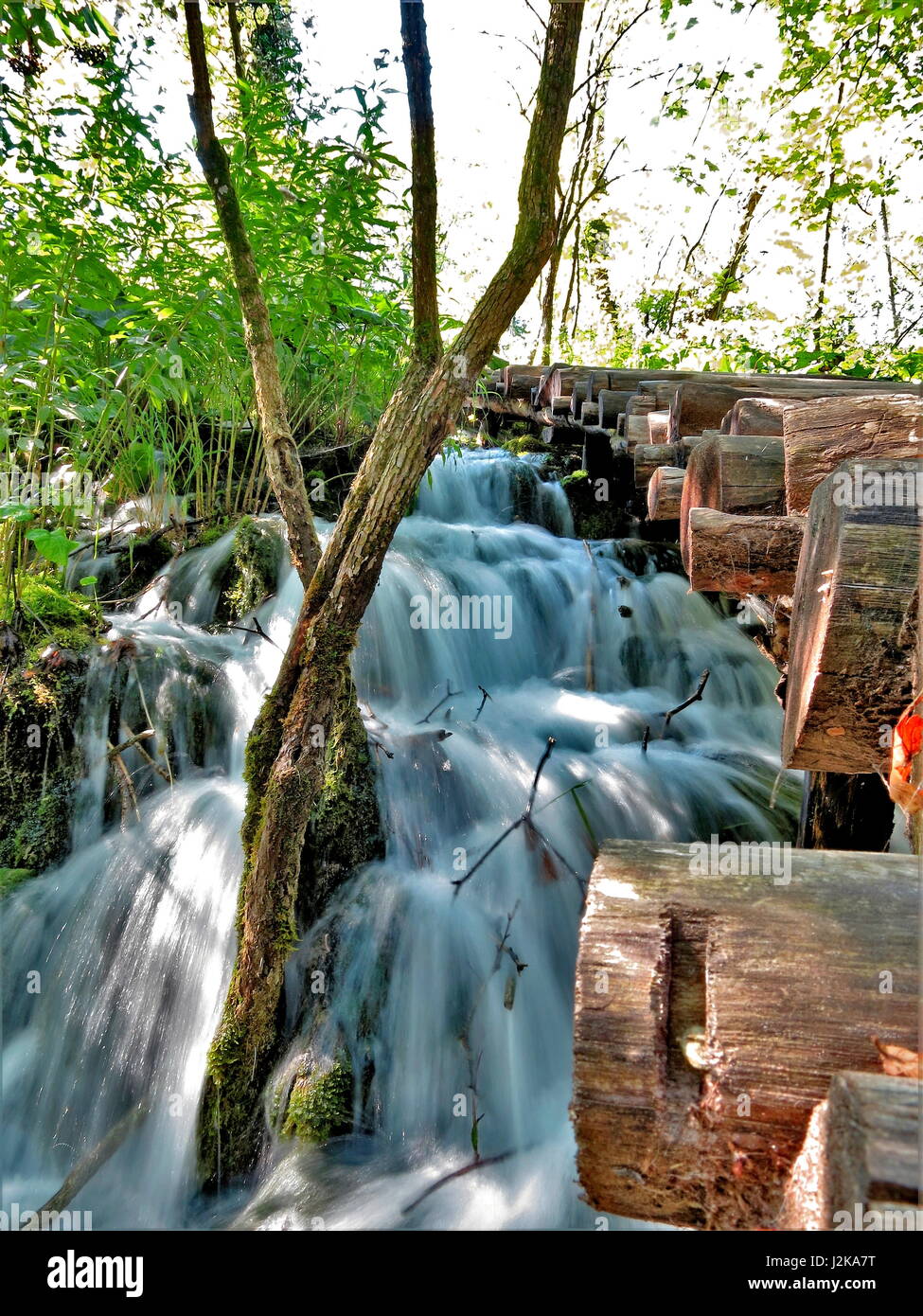 Waterfall along a path Stock Photo - Alamy