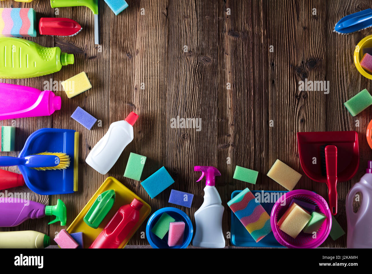 Spring cleanup theme. Variety of colorful house cleaning products on a ...