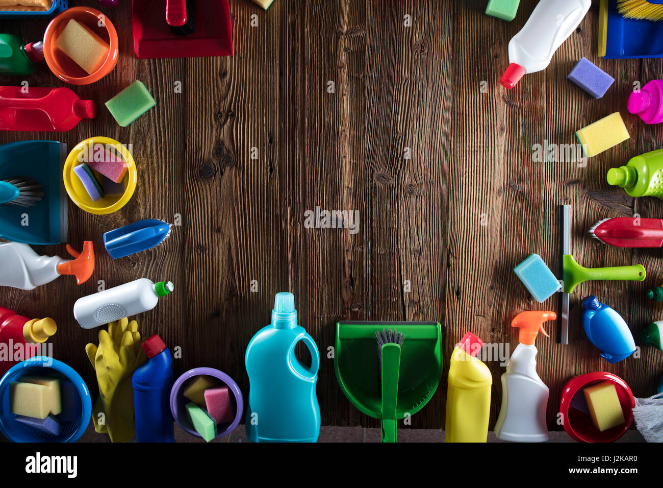 Spring cleanup theme. Variety of colorful house cleaning products on a ...