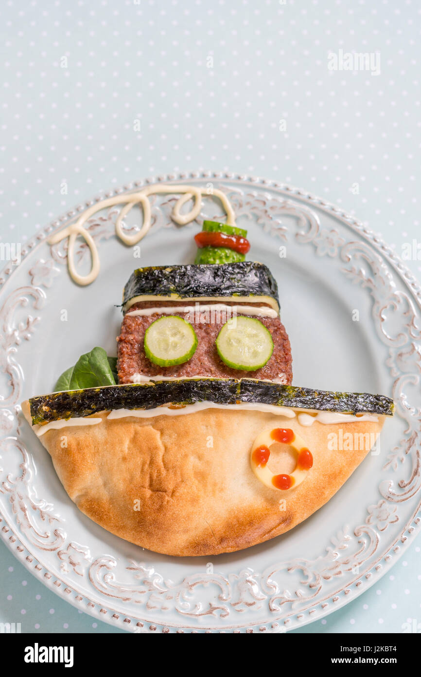 Funny ship boat pita bread with burger cutlet for kids lunch Stock ...