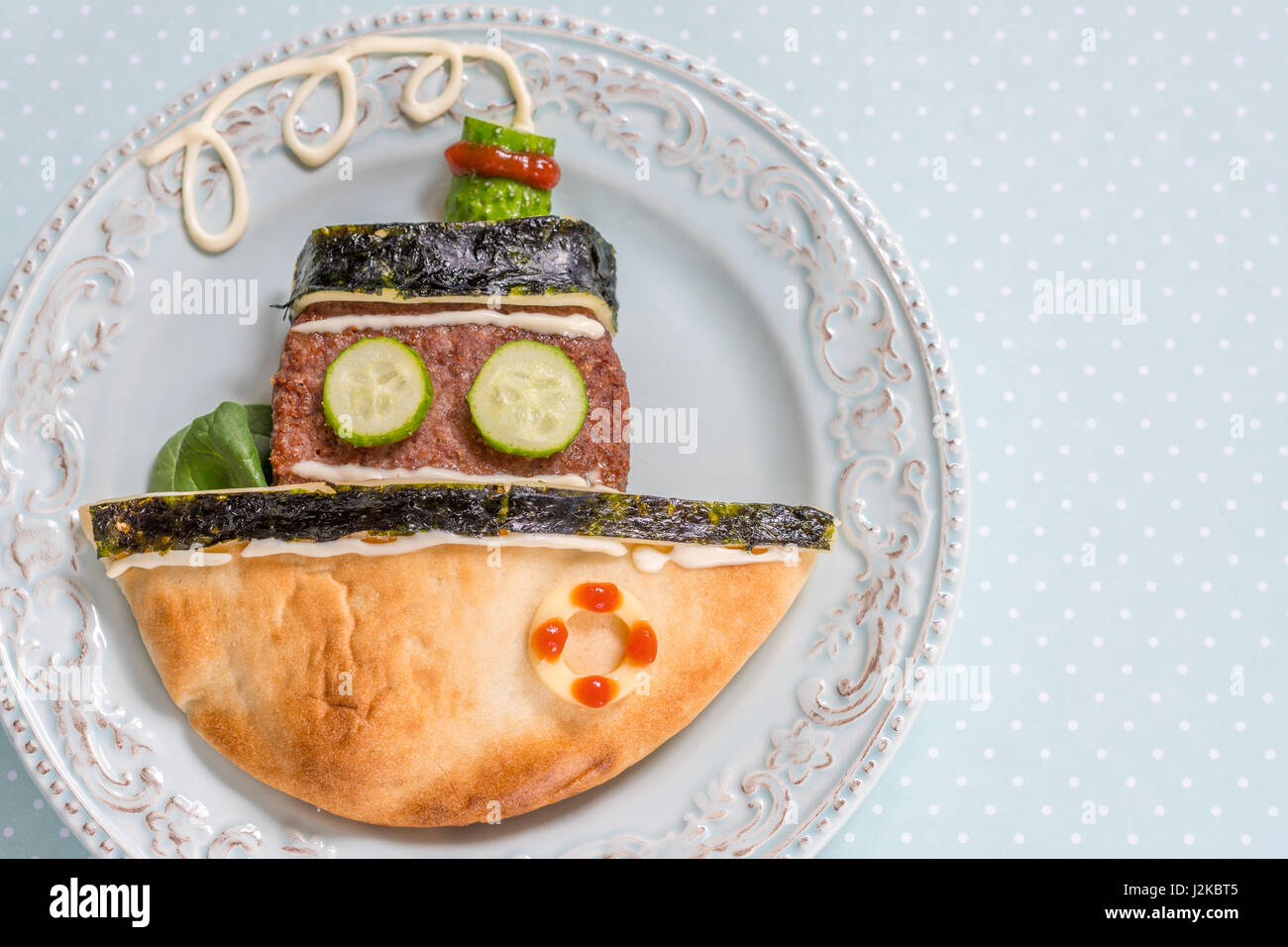 Funny ship boat pita bread with burger cutlet for kids lunch Stock ...