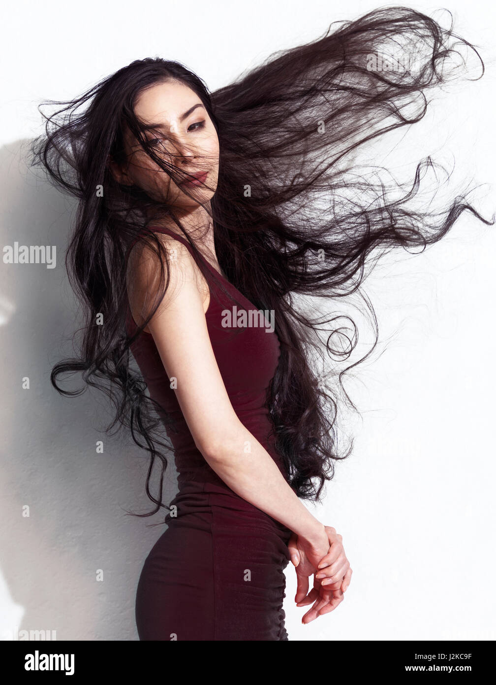 Young woman dress blowing in wind hi-res stock photography and images ...