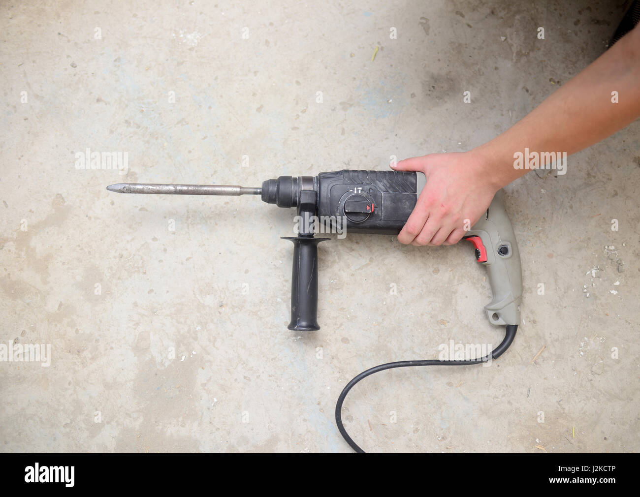 Man works with a drill Stock Photo - Alamy