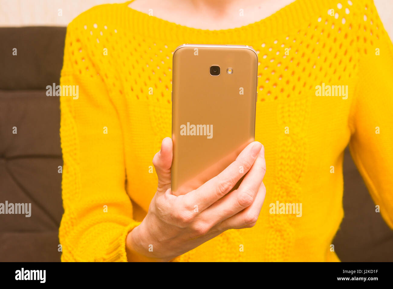 Smartphone in female hands closeup Stock Photo - Alamy