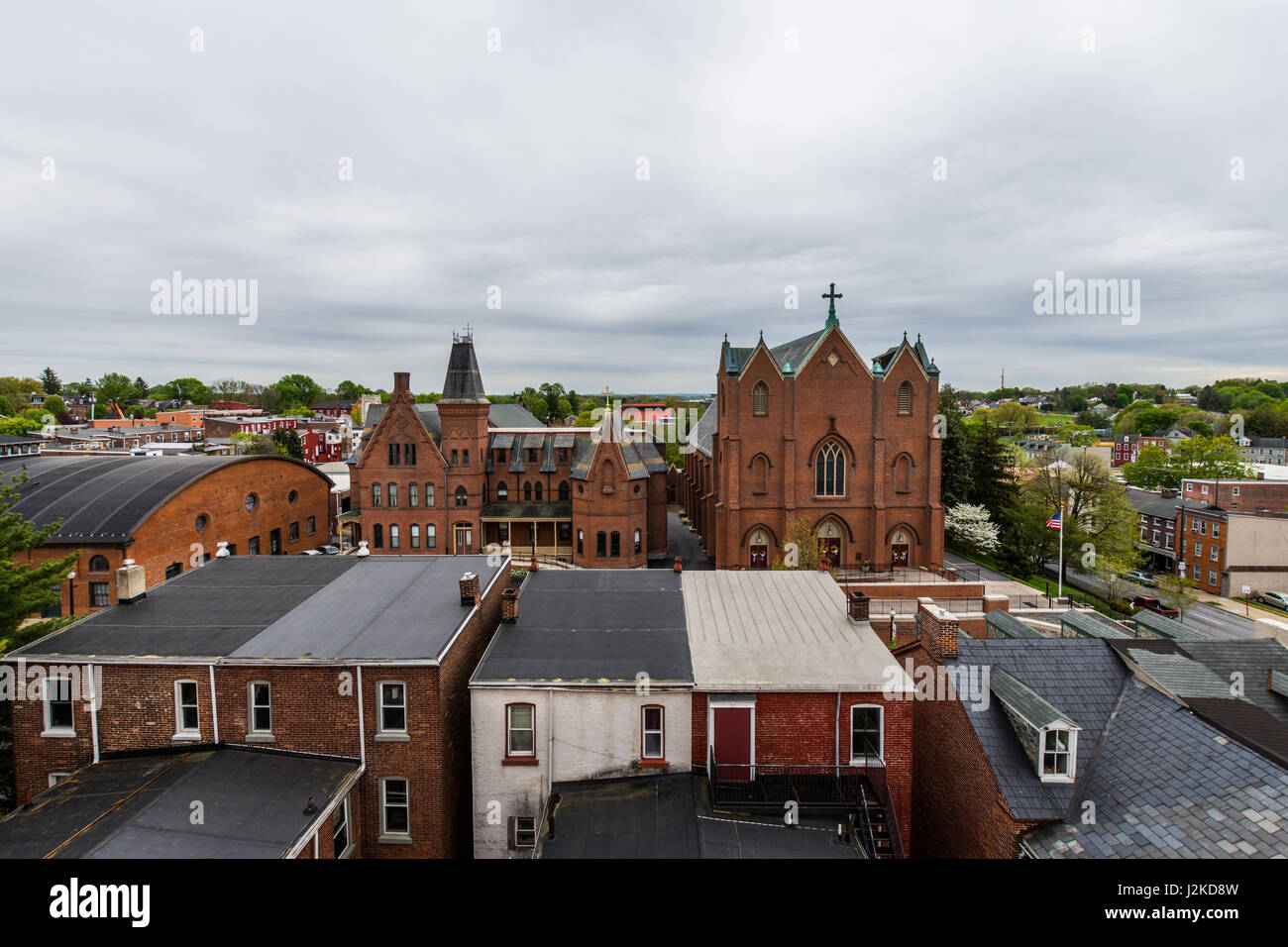 Aerial of historic downtown Lancaster, Pennsylvania with blooming trees ...