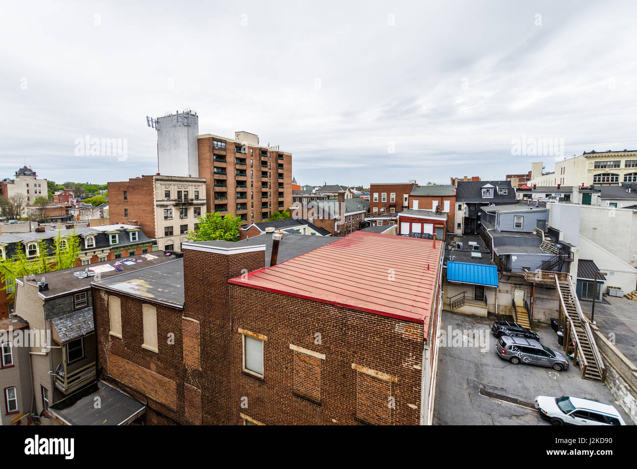 Aerial of historic downtown Lancaster, Pennsylvania with blooming trees ...