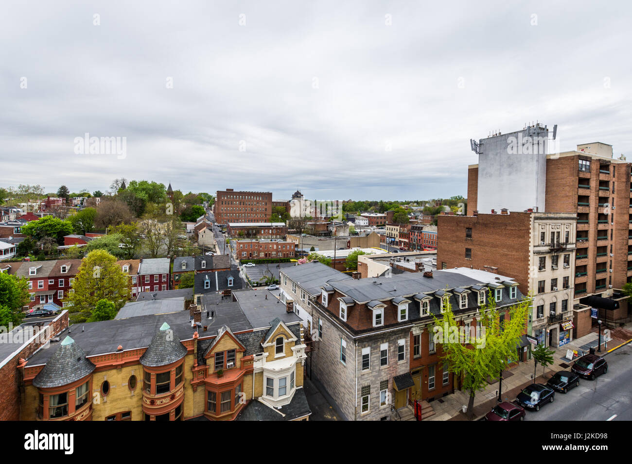 Aerial of historic downtown Lancaster, Pennsylvania with blooming trees ...