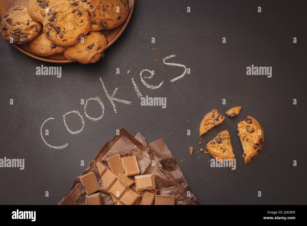 Chocolate chip cookies with word cookies written with chalk on ...