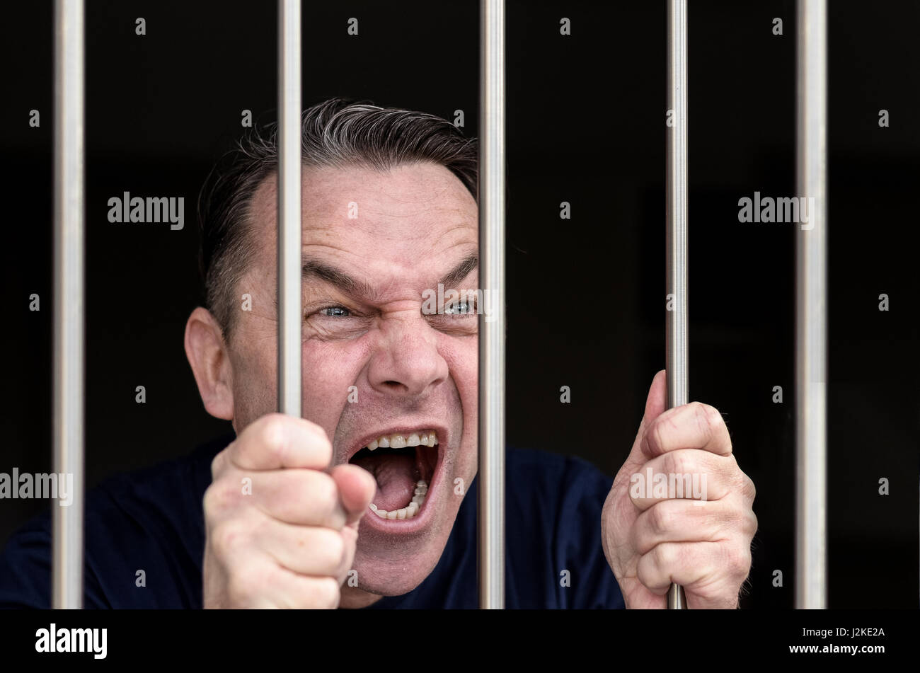 Man in prison cell hi-res stock photography and images - Alamy