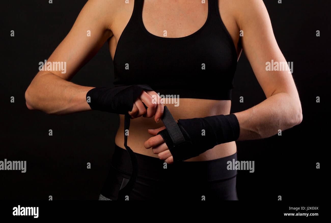 female boxer wrapping hands with boxing tape Stock Photo - Alamy