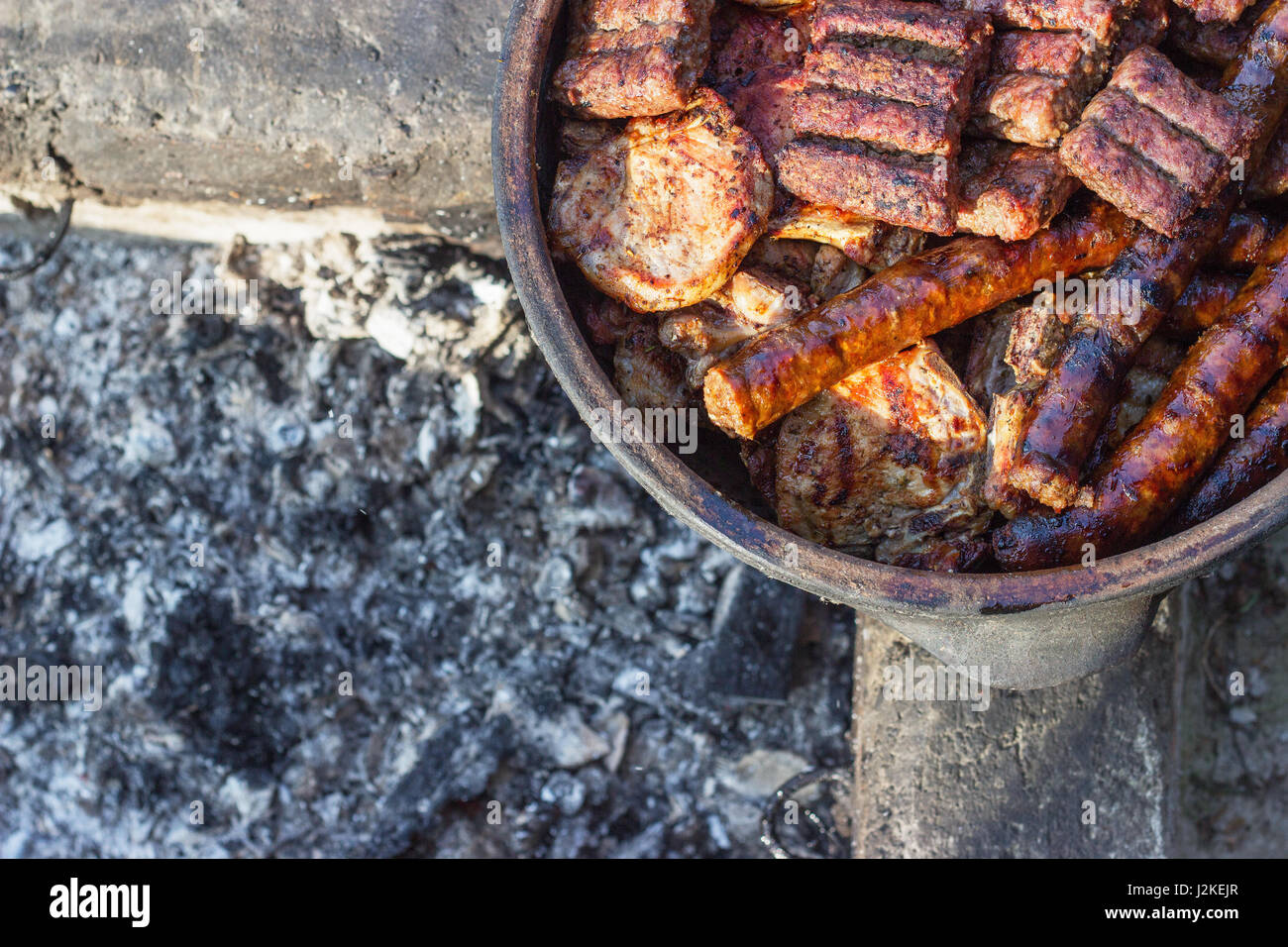 Barbecue - grilled meat in big clay bowl Stock Photo - Alamy