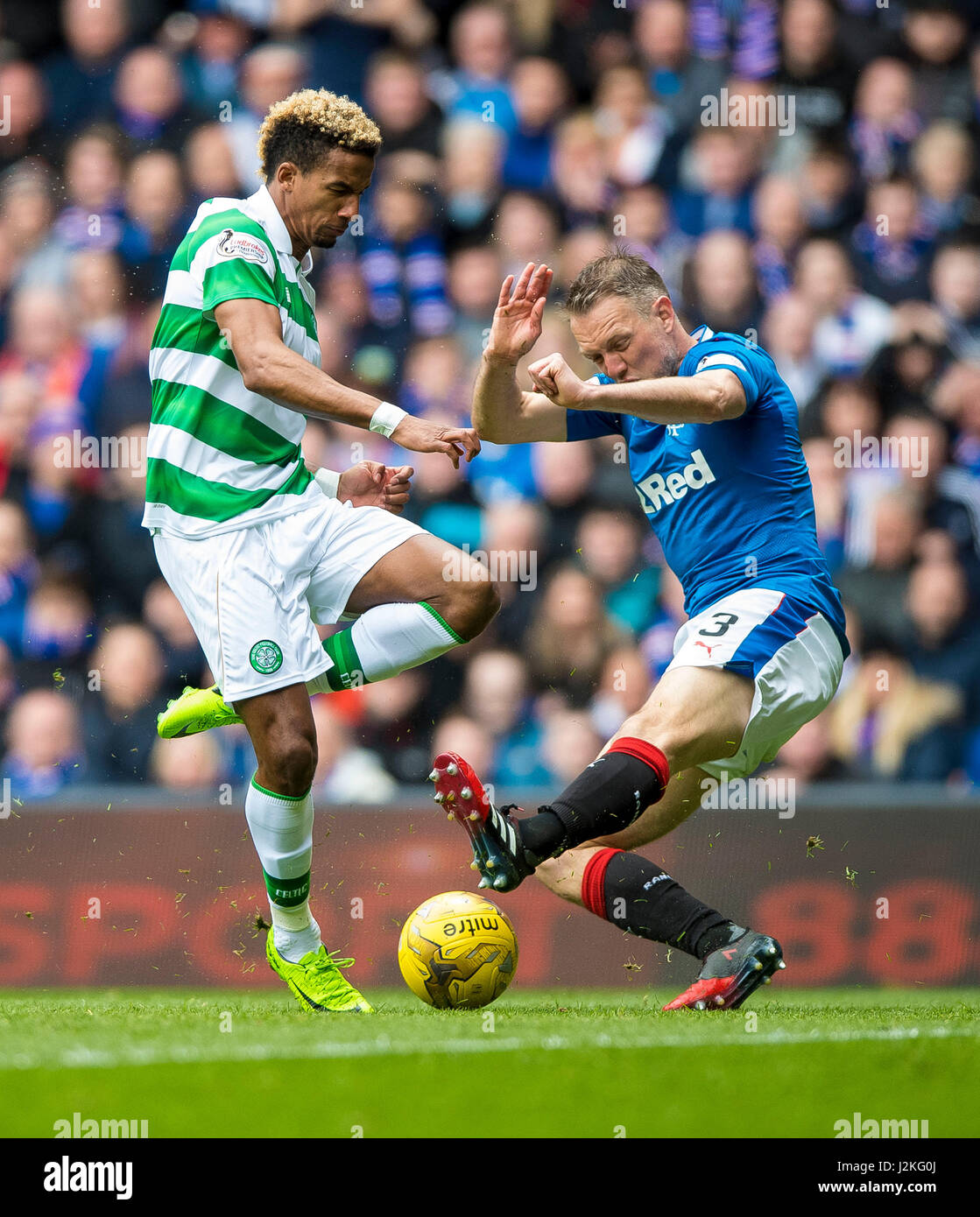 Celtic's Scott Sinclair and Rangers' Clint Hill compete for the ball ...