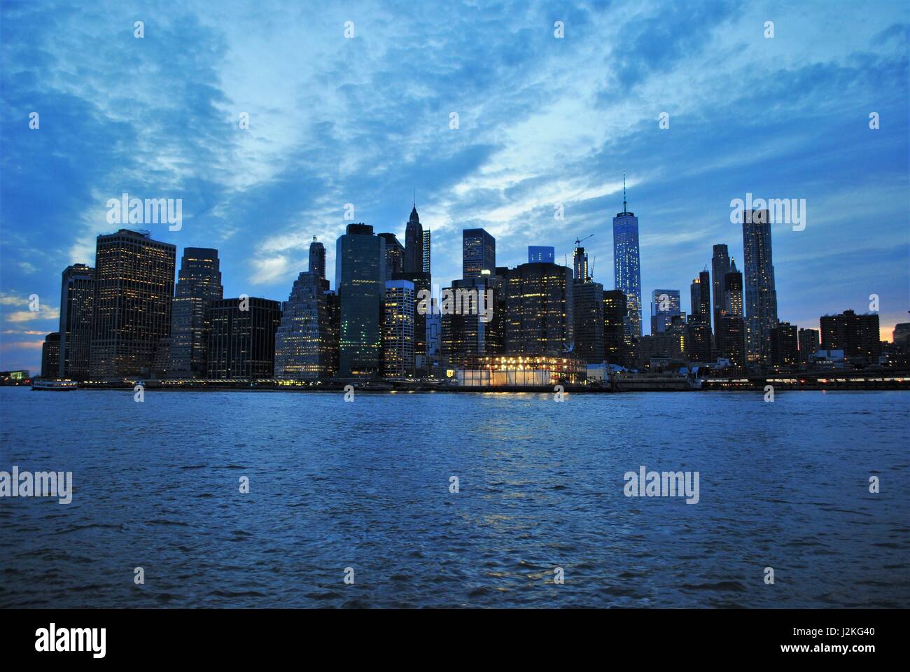 The Lower Manhattan sunset view from the East River Stock Photo - Alamy