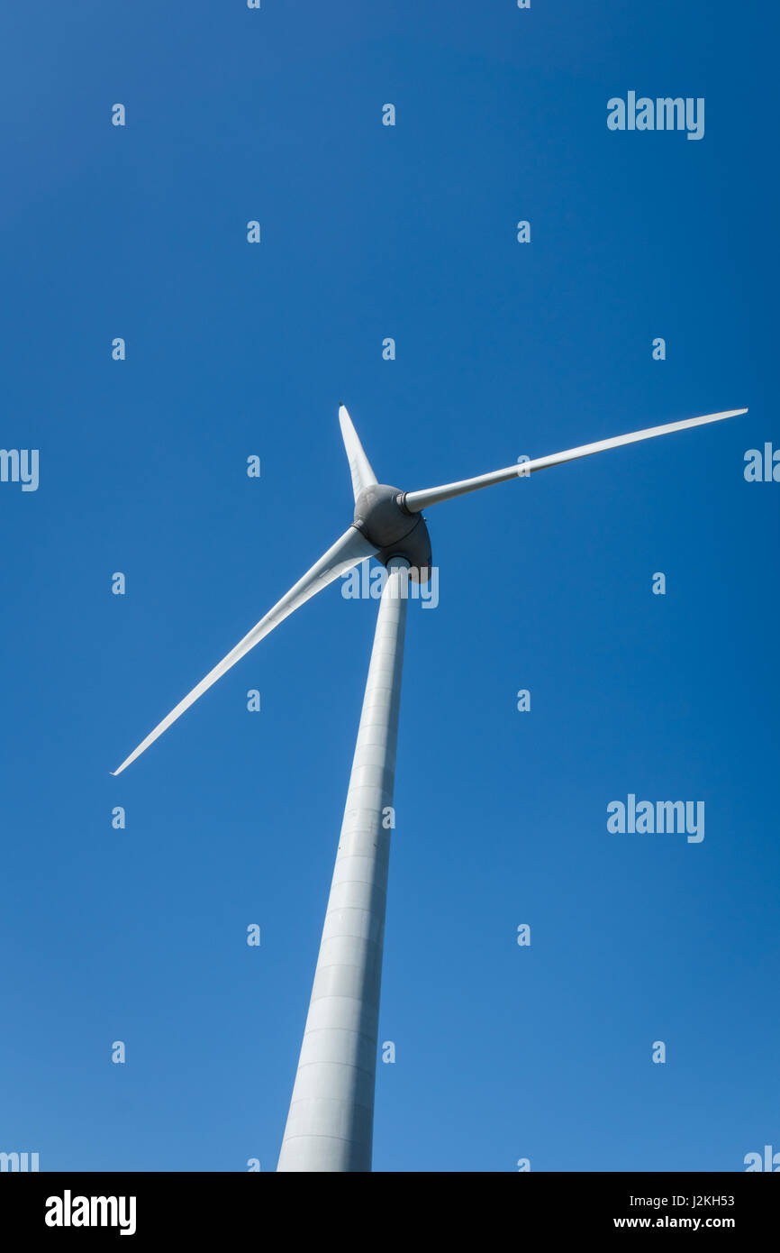 wind energy turbine / modern wind mill against blue sky background ...