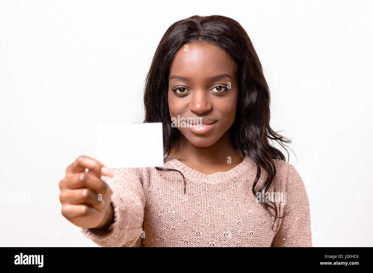 Attractive young African woman with her business card holding it out ...