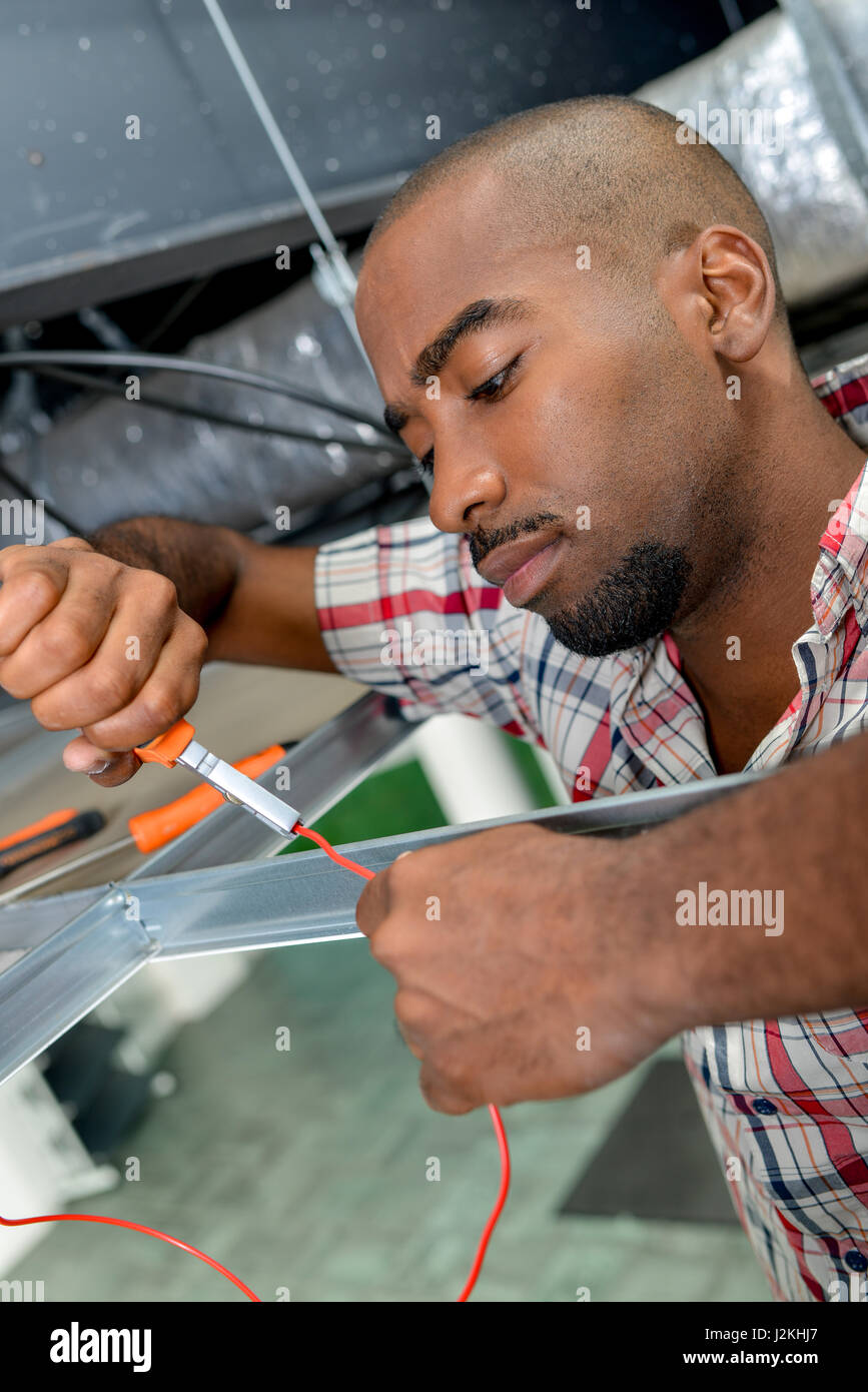 Man holding cable Stock Photo - Alamy