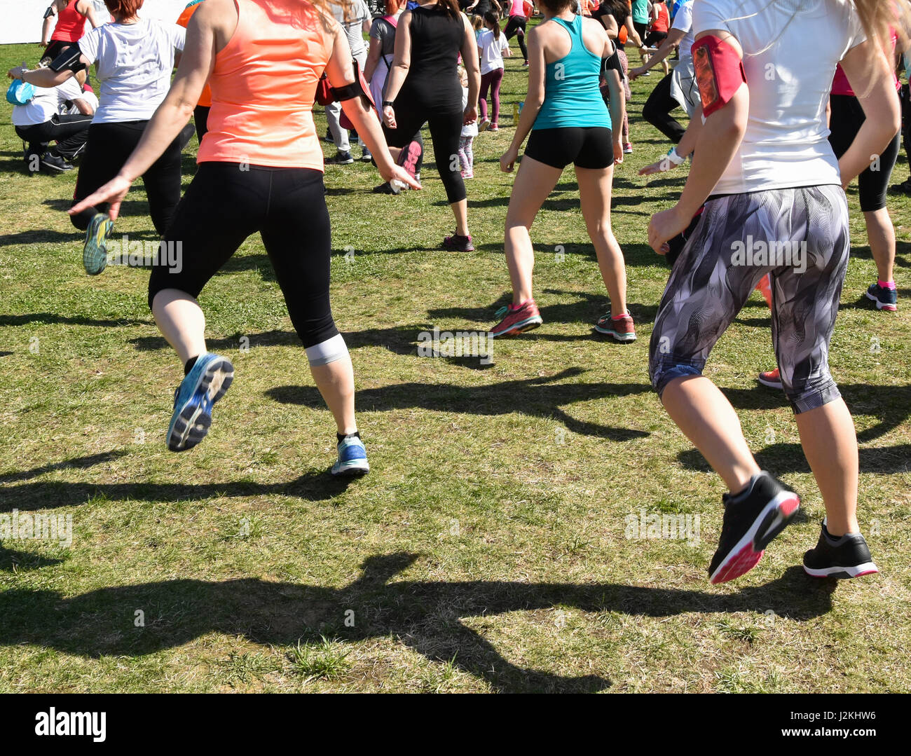 Women are warming up before running race Stock Photo - Alamy