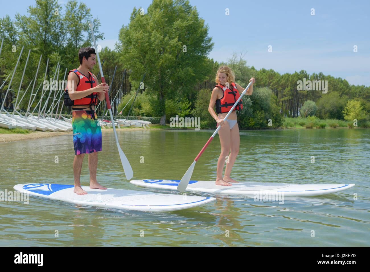 week-end practice of stand-up board Stock Photo - Alamy